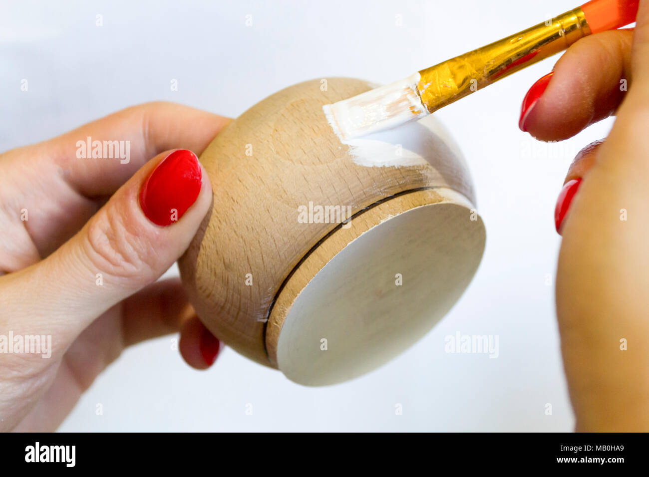 Woman painting wooden detail in white. Handmade, diy, Closeup photo ...