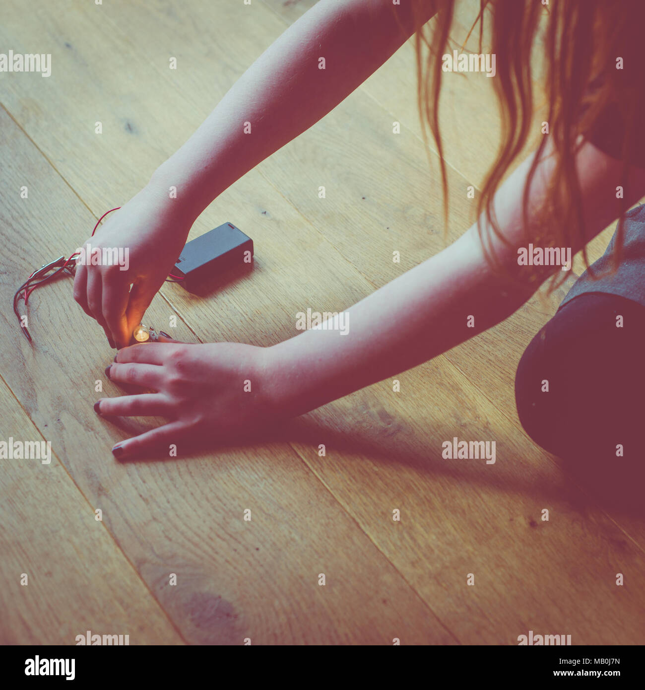 Girl Works with Electronics Kit Components Stock Photo - Alamy