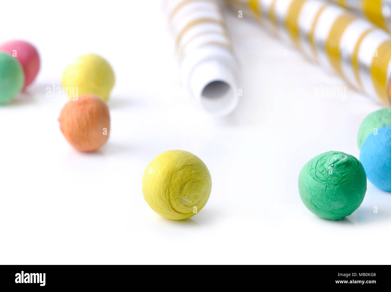 close on colorful balls and blowpipe for party isolated on white ...