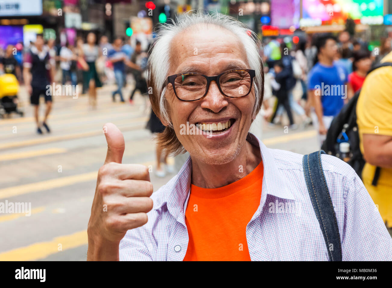 China, Hong Kong, Causeway Bay, Smiling Man Giving Thumbs Up Sign Stock ...