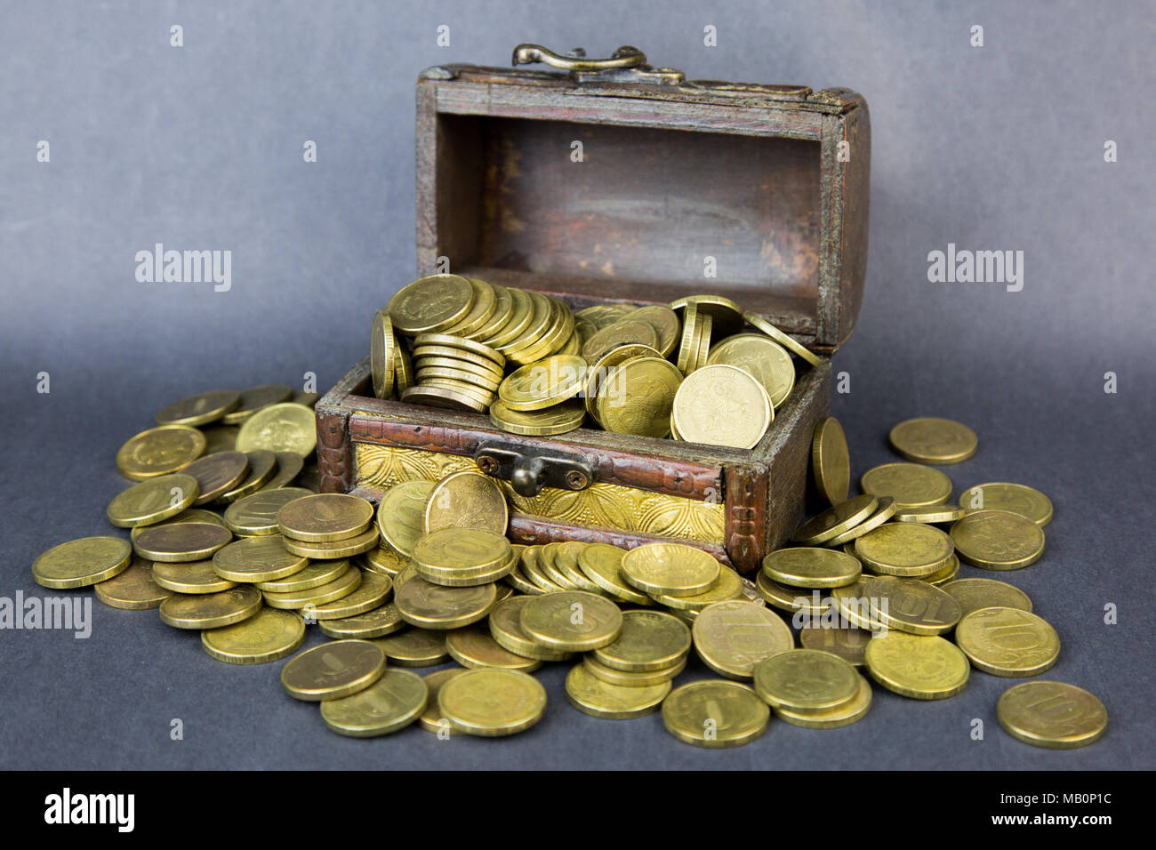 Chest full of jewelry of metal coins and other treasures Stock Photo ...