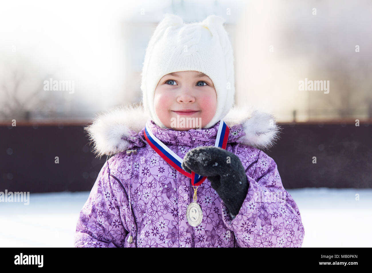 Little girl was awarded a medal for winning a sports match Stock Photo ...