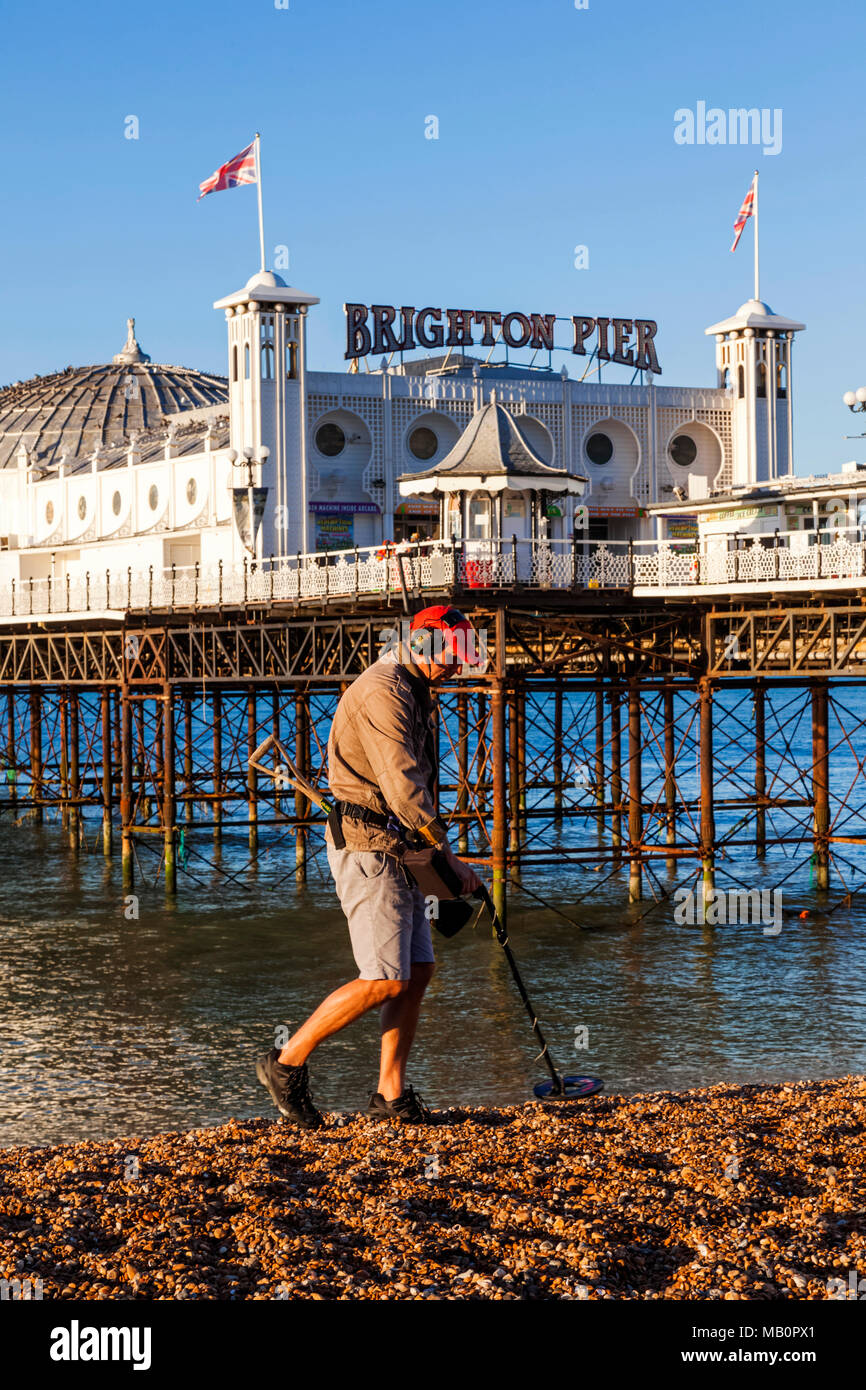 England, East Sussex, Brighton, Man with Metal Detector on Beach and ...
