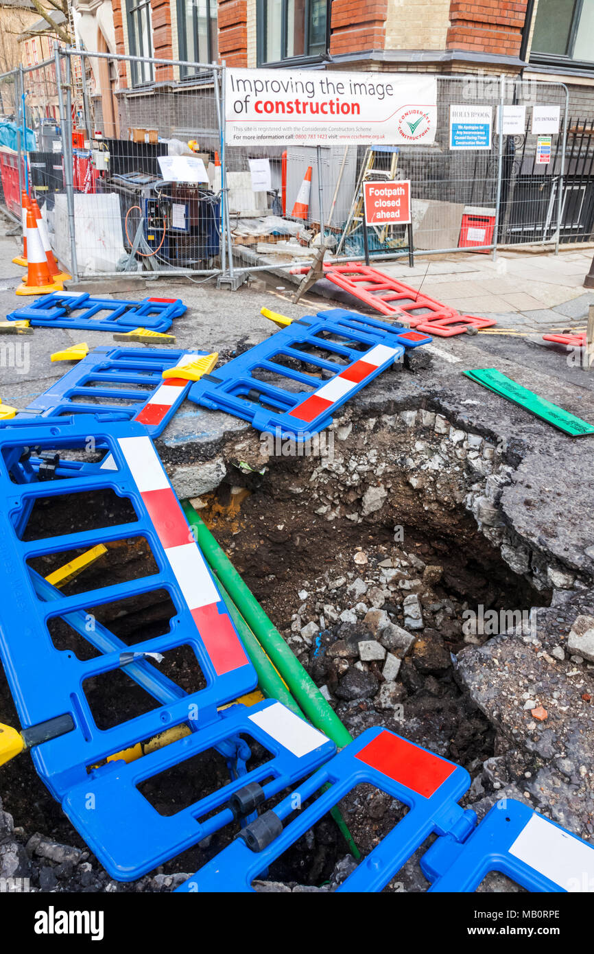 Hole in road and construction sign hi-res stock photography and images ...