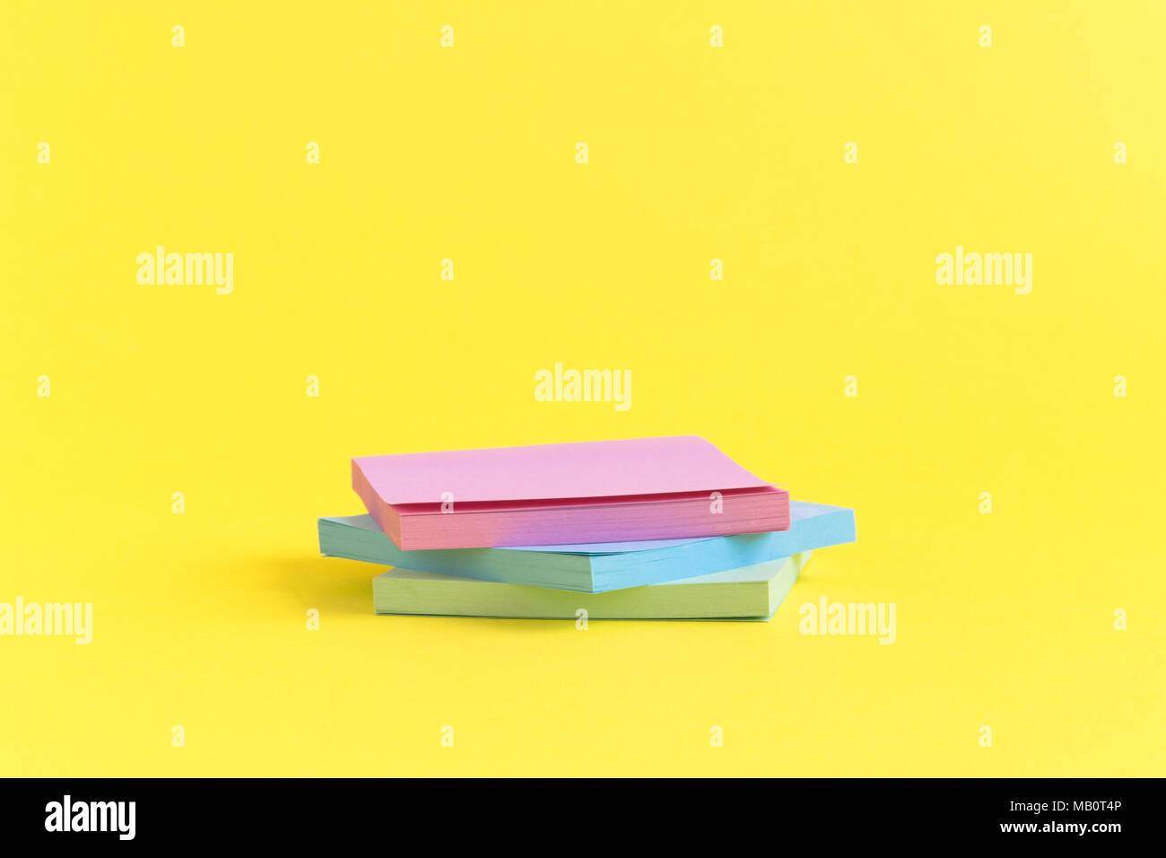 Sticky notes in different colors on yellow background minimal concept ...