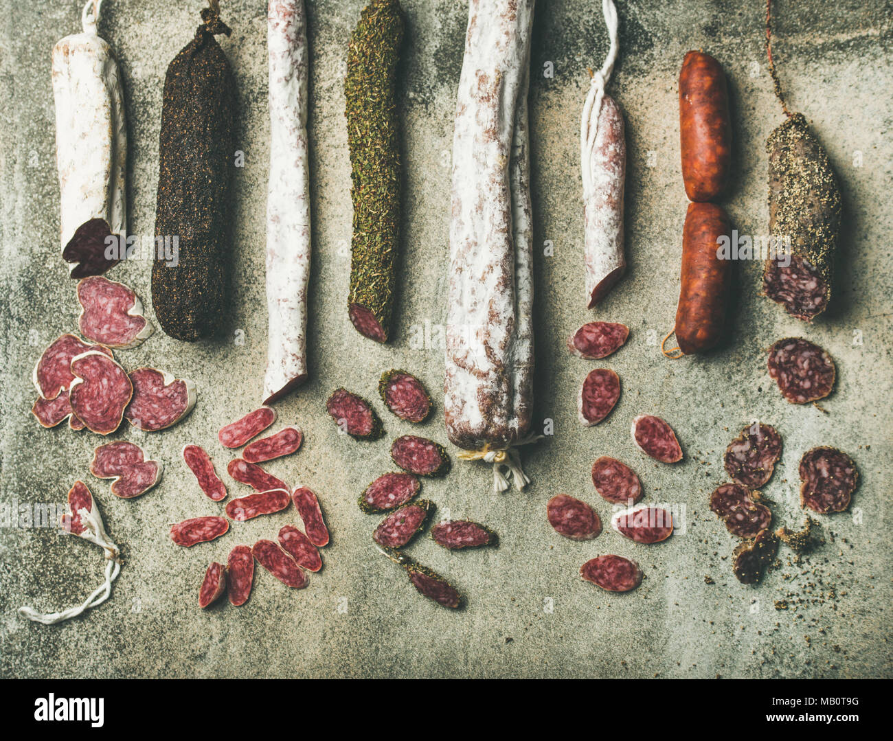 Variety of Spanish or Italian cured sausages cut in slices Stock Photo ...