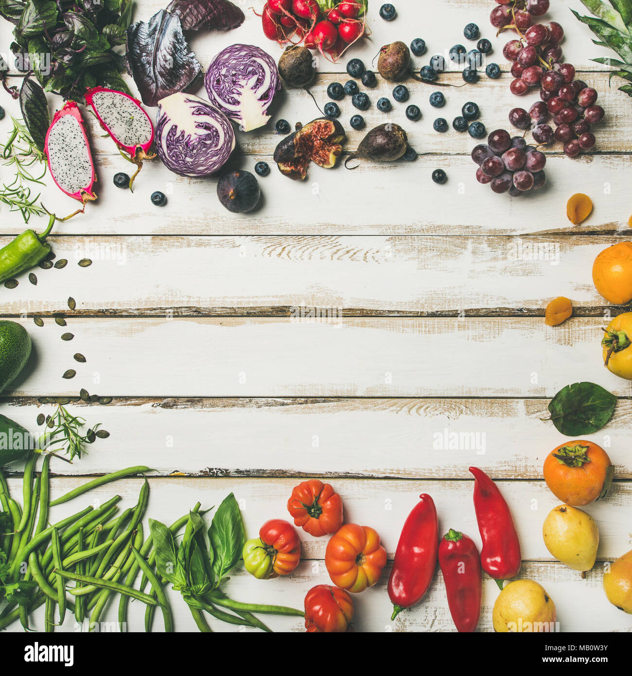 Flat-lay of fresh fruit, vegetables, greens and superfoods, square crop ...