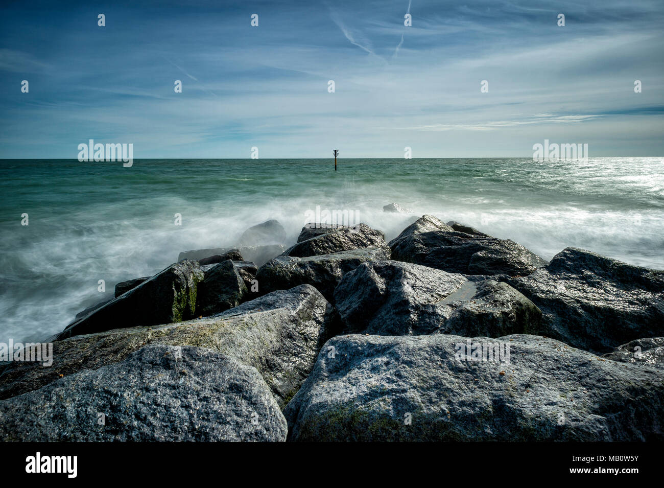 Large granite rocks forming a sea defence at Hayling Island. Long ...