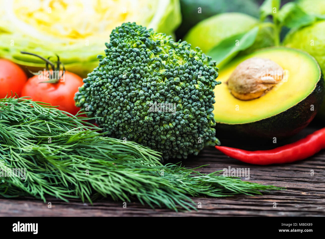 Fresh vegetables, lime and avocado close Stock Photo - Alamy