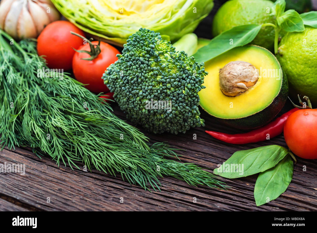 Fresh vegetables, lime and avocado close Stock Photo - Alamy