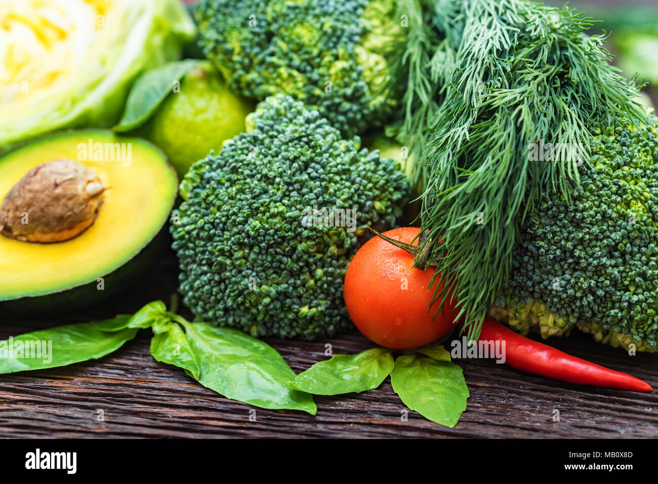 Fresh vegetables, lime and avocado close Stock Photo - Alamy