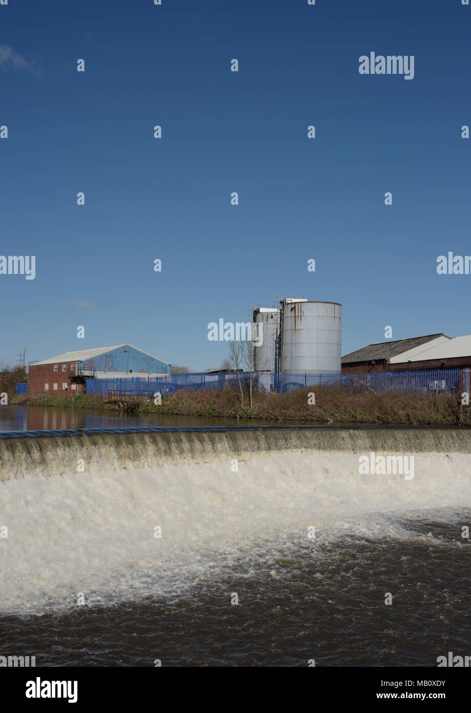 Weir on the river irwell causing turbulent flow of water downstream ...