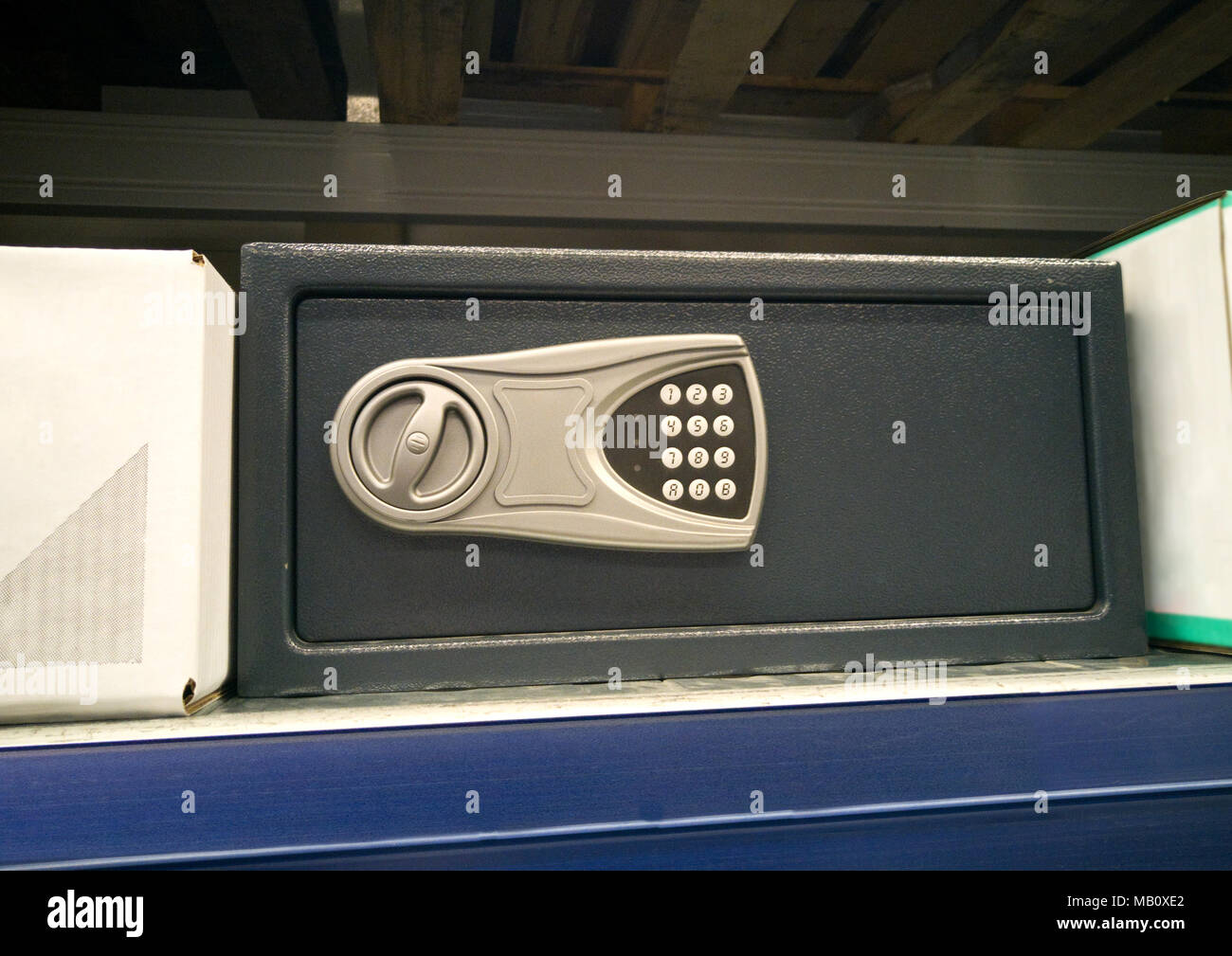 On the shop window is a gray metal safe Stock Photo - Alamy