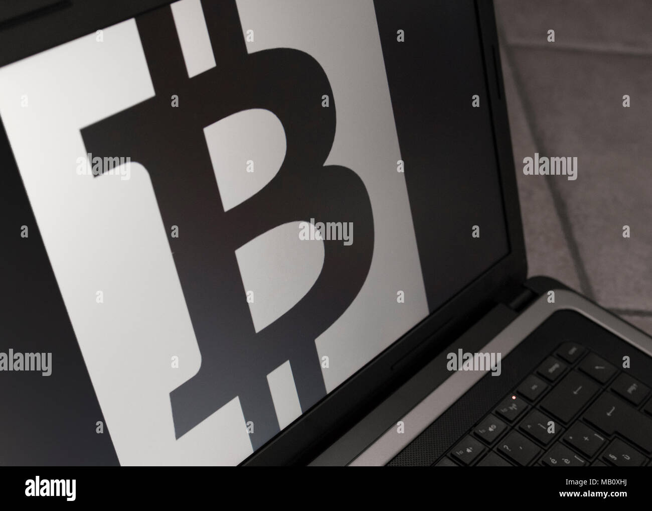 Bitcoin symbol on the screen of a notebook Stock Photo - Alamy