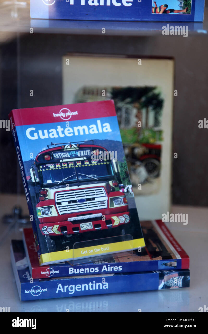 Old travel guides in the window of a second hand bookshop Stock Photo ...