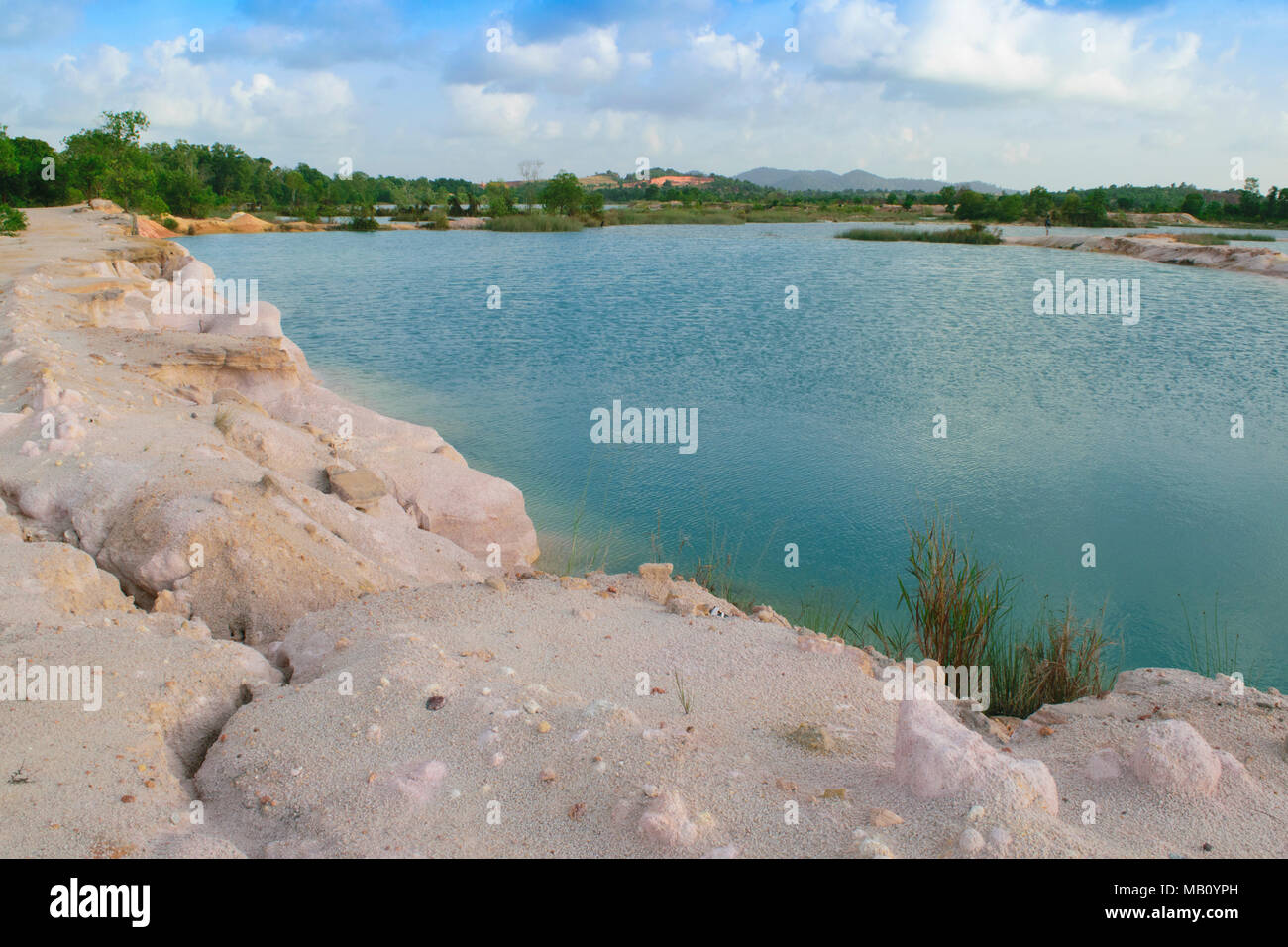 scenic landscape blue lake and white sands against blue sky at Galang ...