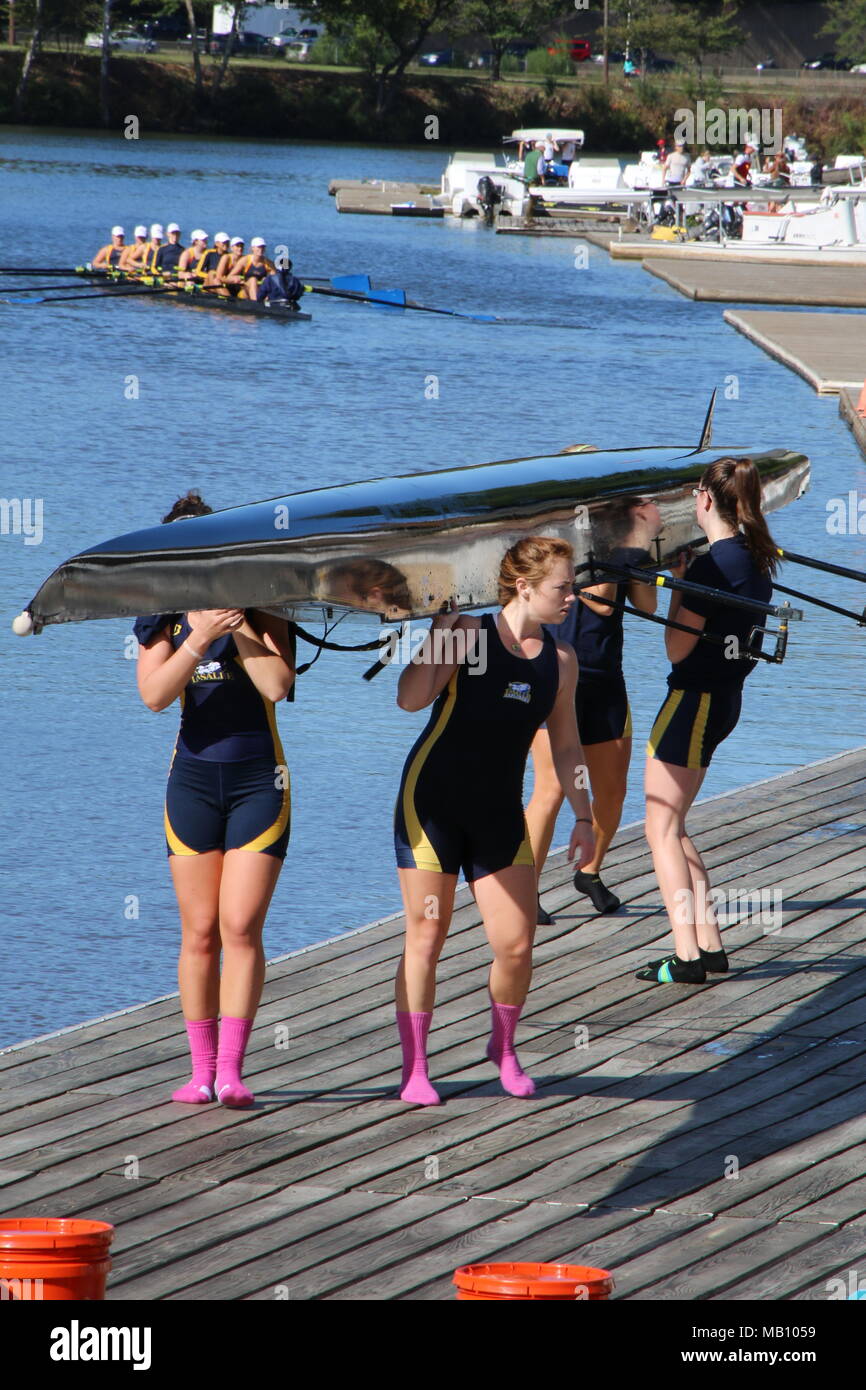 The crew is carrying their boat to the wter Stock Photo - Alamy