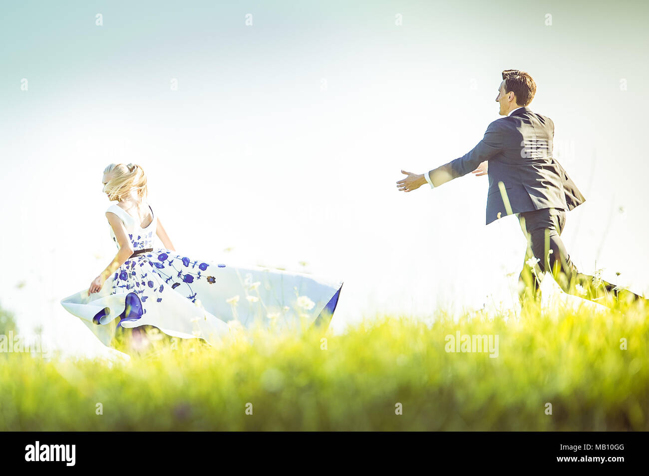 Groom chasing bride hi-res stock photography and images - Alamy
