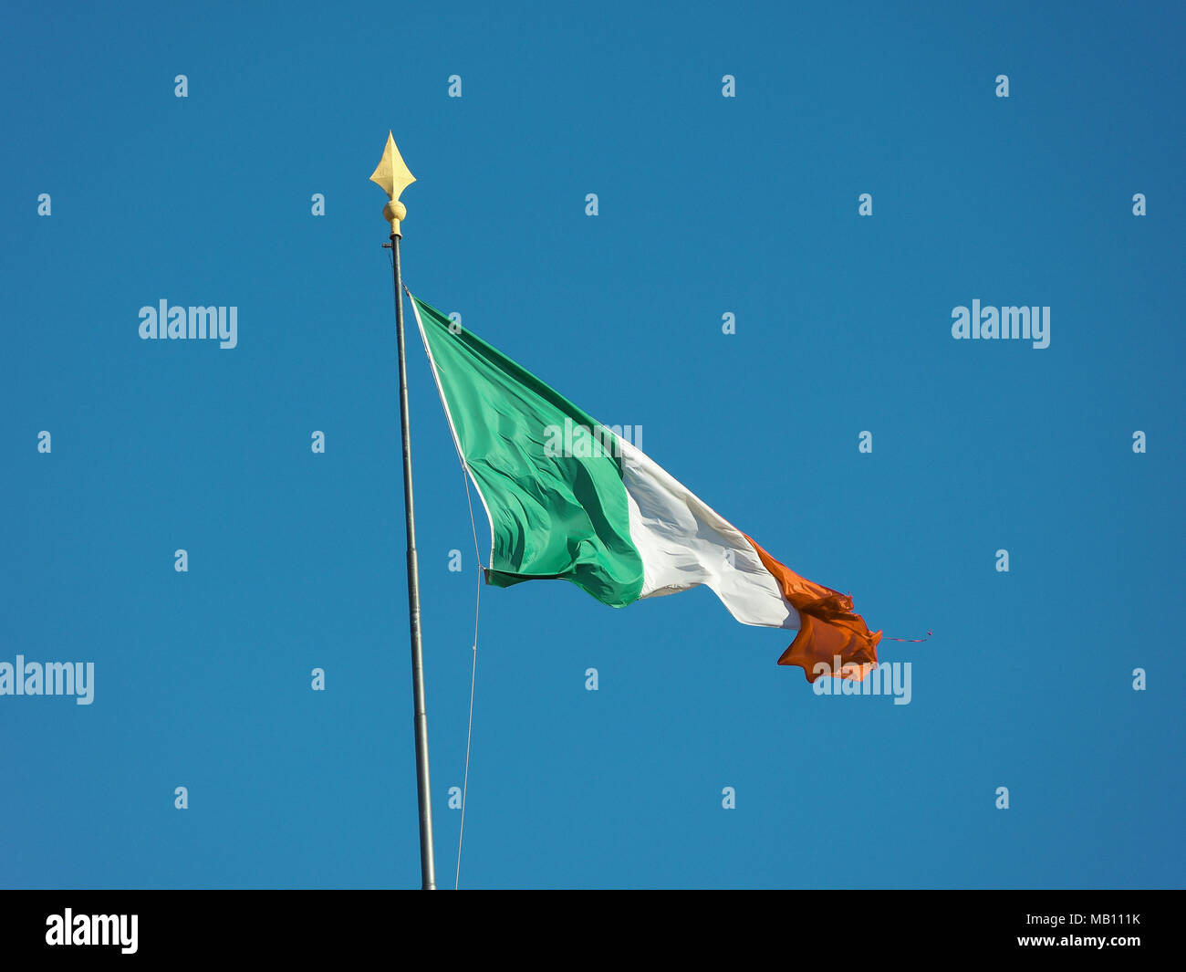 the Irish national flag of Ireland, Europe over blue sky Stock Photo ...