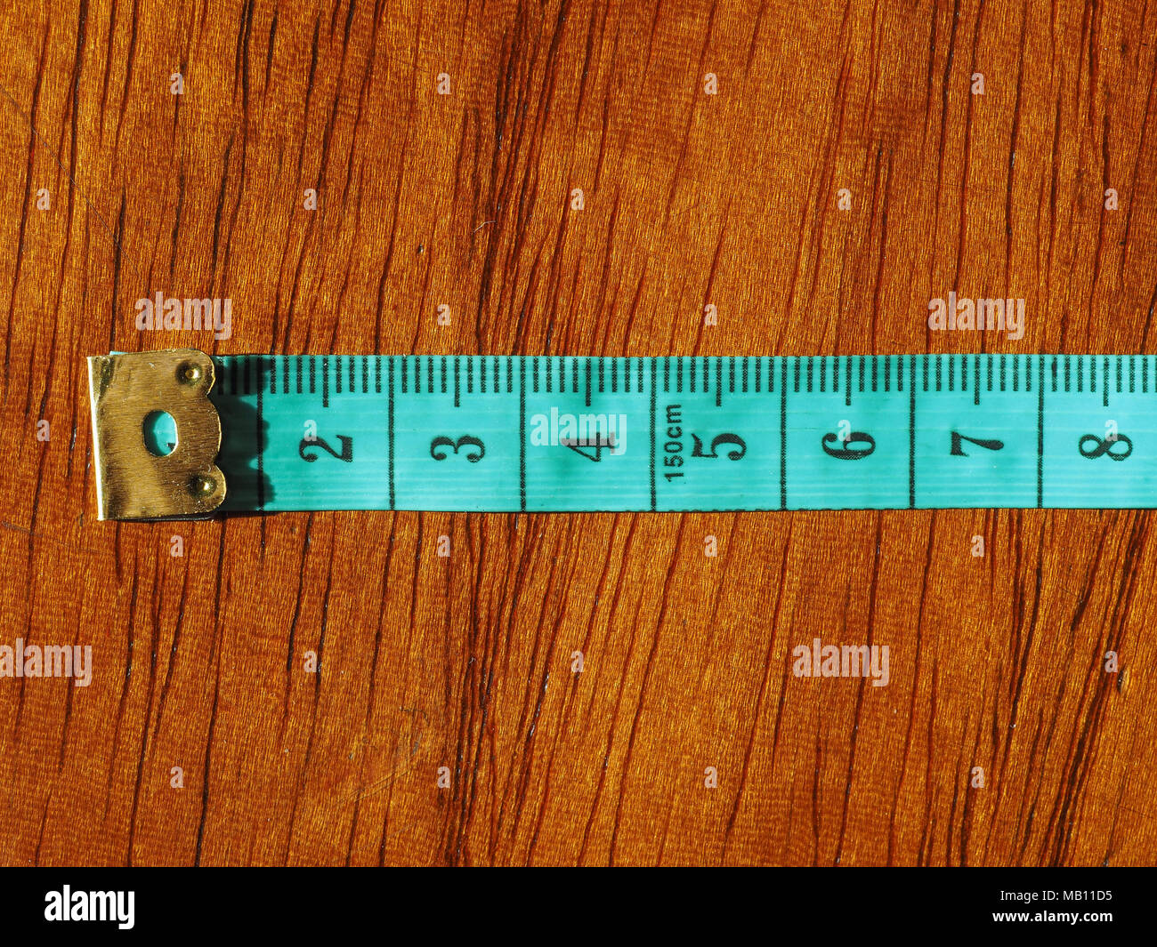 soft tailor meter ruler in metric units on a wooden desk Stock Photo ...