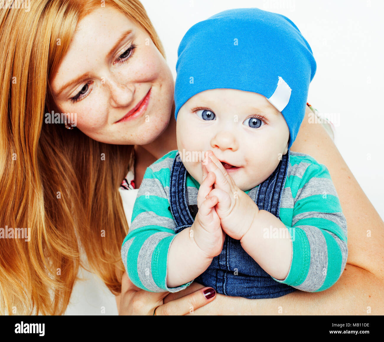 young beauty mother with cute baby, red head happy modern family Stock ...