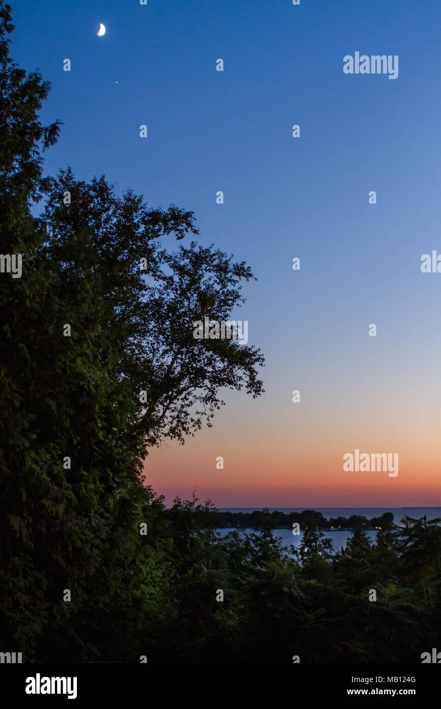 Moon over Lake Michigan Stock Photo - Alamy