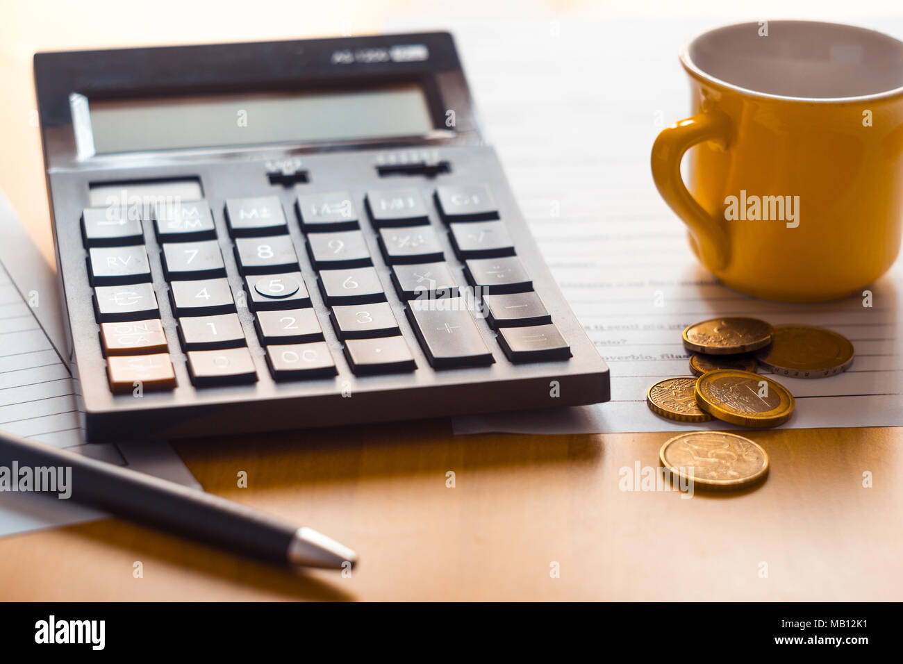 Tax documents coins calculator hi-res stock photography and images - Alamy
