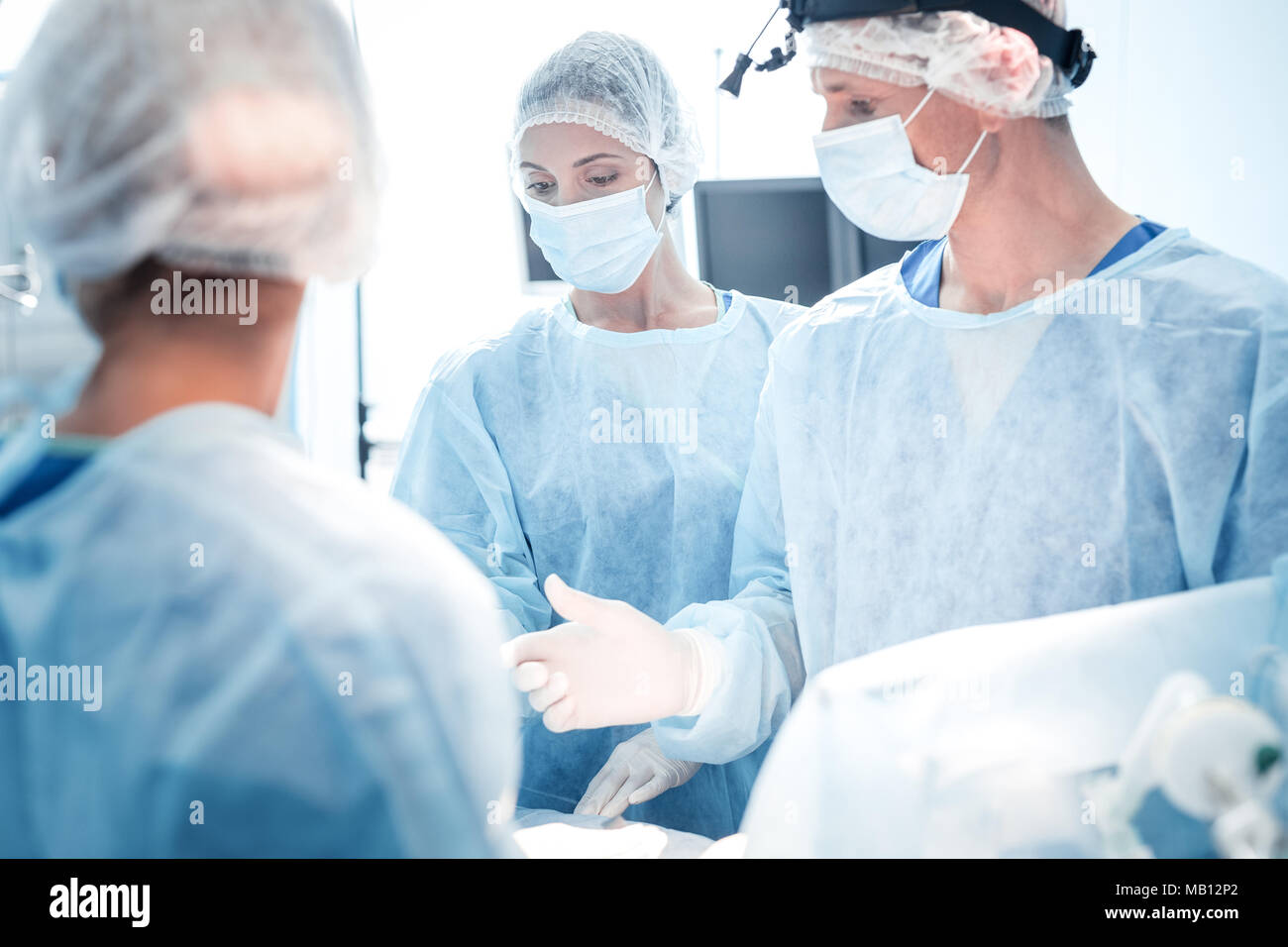 Nice handsome surgeon working Stock Photo - Alamy