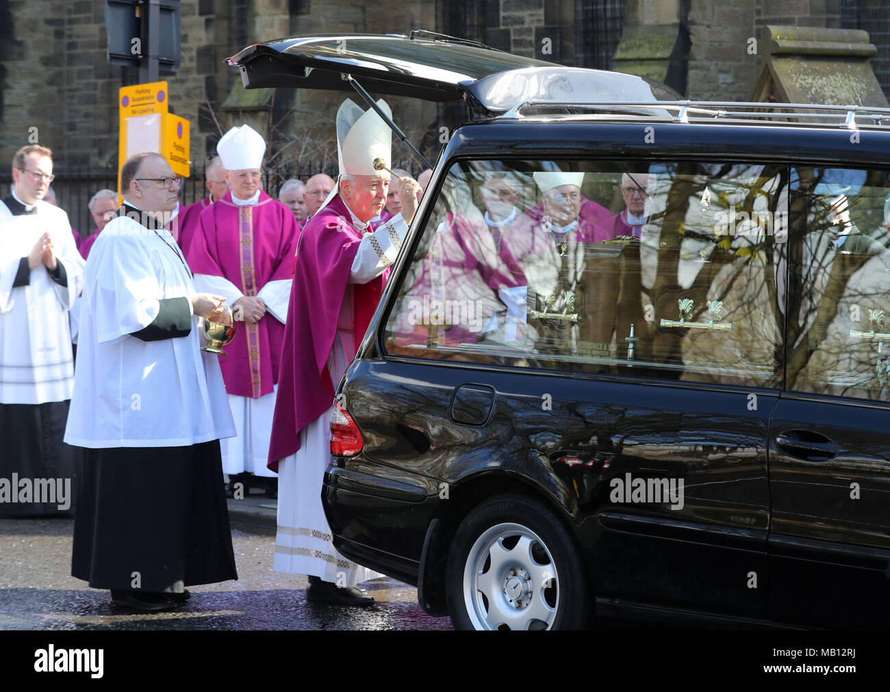 Cardinal Vincent Nichols, Archbishop of Westminster, blesses the coffin ...