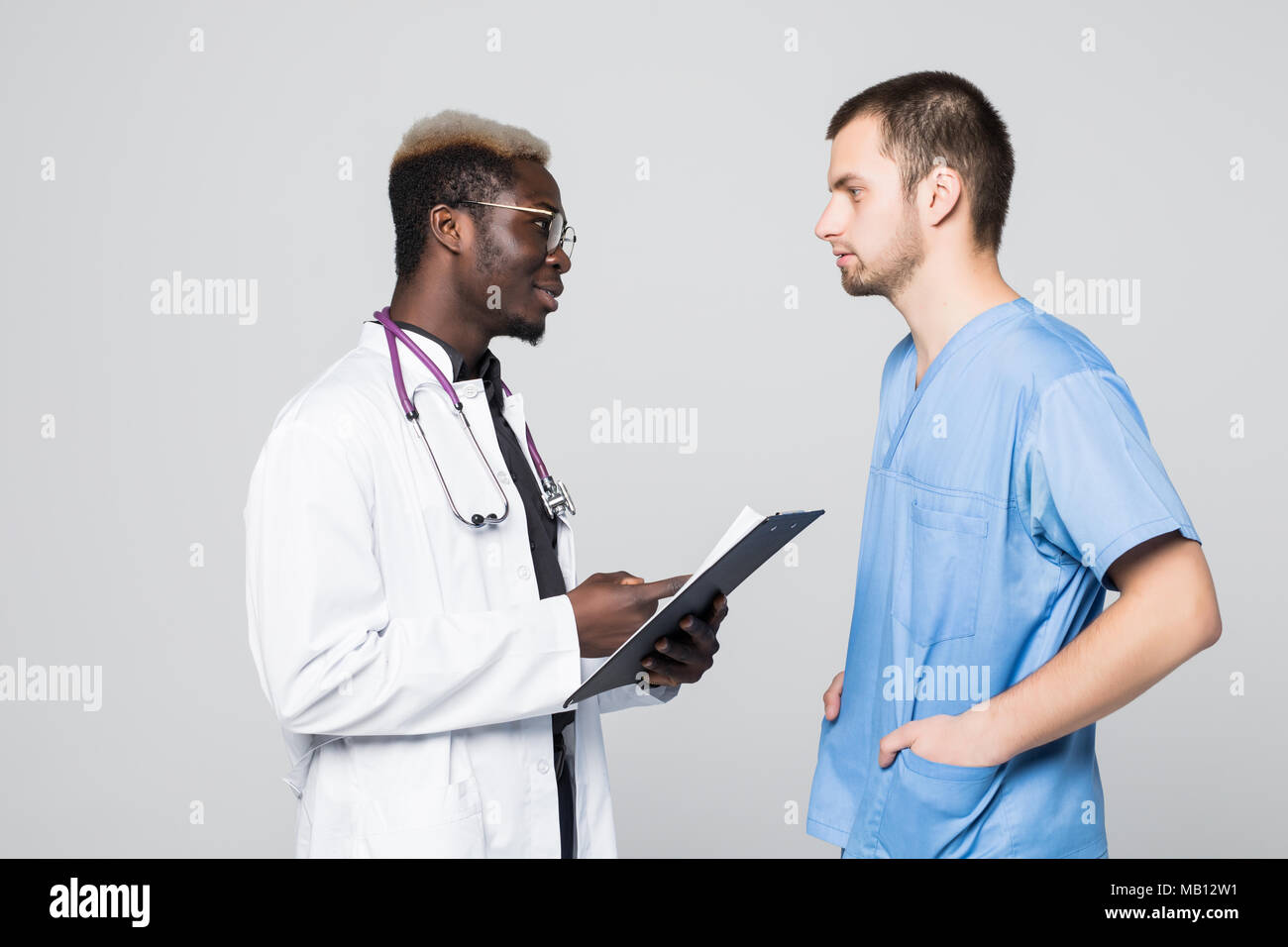 African patient doctor shaking hands hi-res stock photography and ...