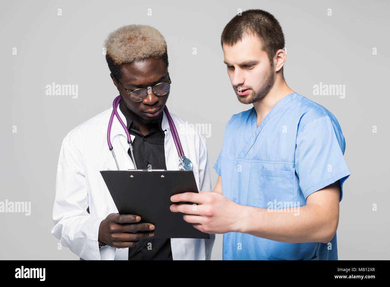 Two male doctors with isolated white background Stock Photo - Alamy
