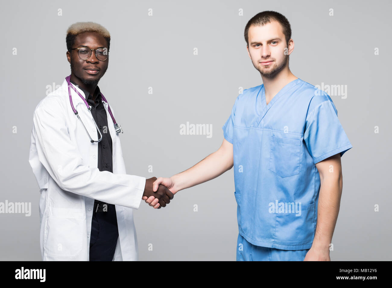 Medical handshake. Doctoral meeting. Two confident doctor standing ...