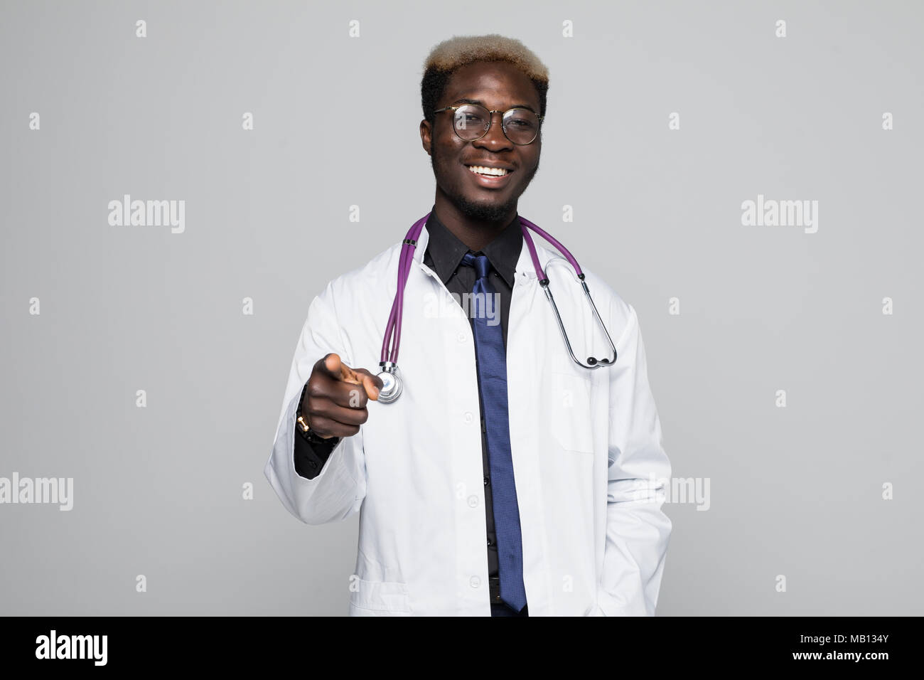 Angry african black male doctor pointing finger at you with stethoscope ...