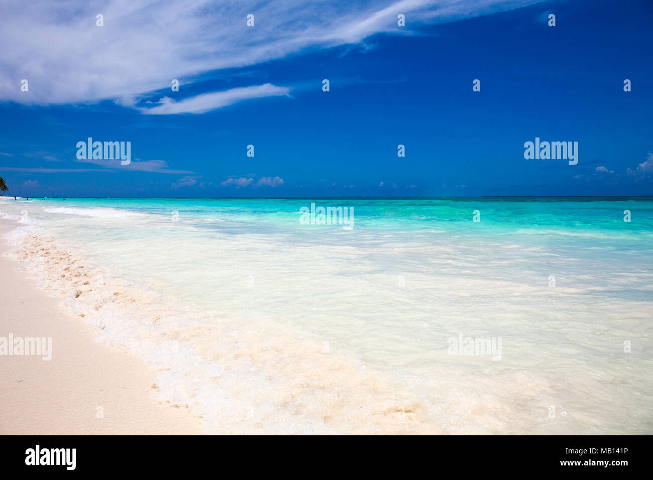 tropical beach with blue water background Stock Photo - Alamy