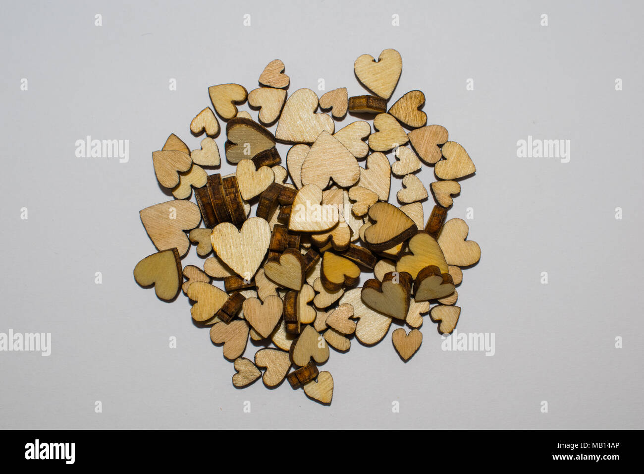 Pile of wooden hearts on white background Stock Photo - Alamy