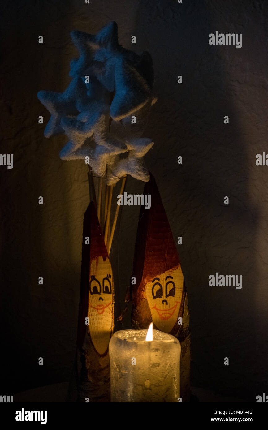 wooden dwarf in candle light Stock Photo - Alamy