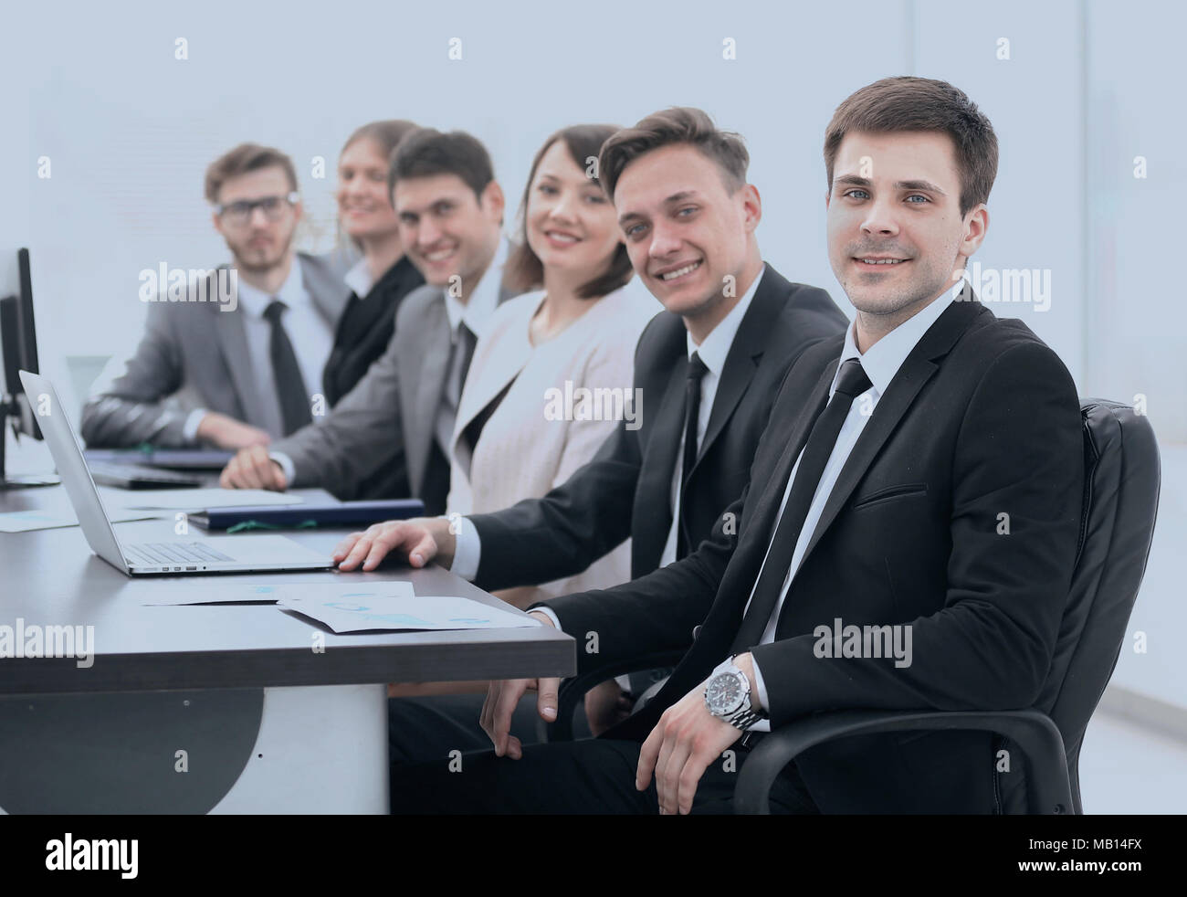 boss and a professional business team in office Stock Photo - Alamy