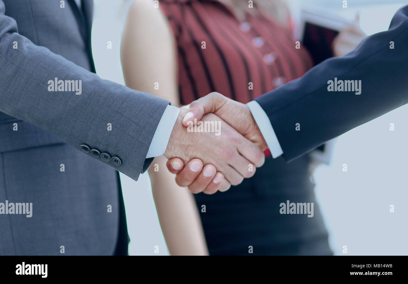 Successful business people handshaking after good deal Stock Photo - Alamy