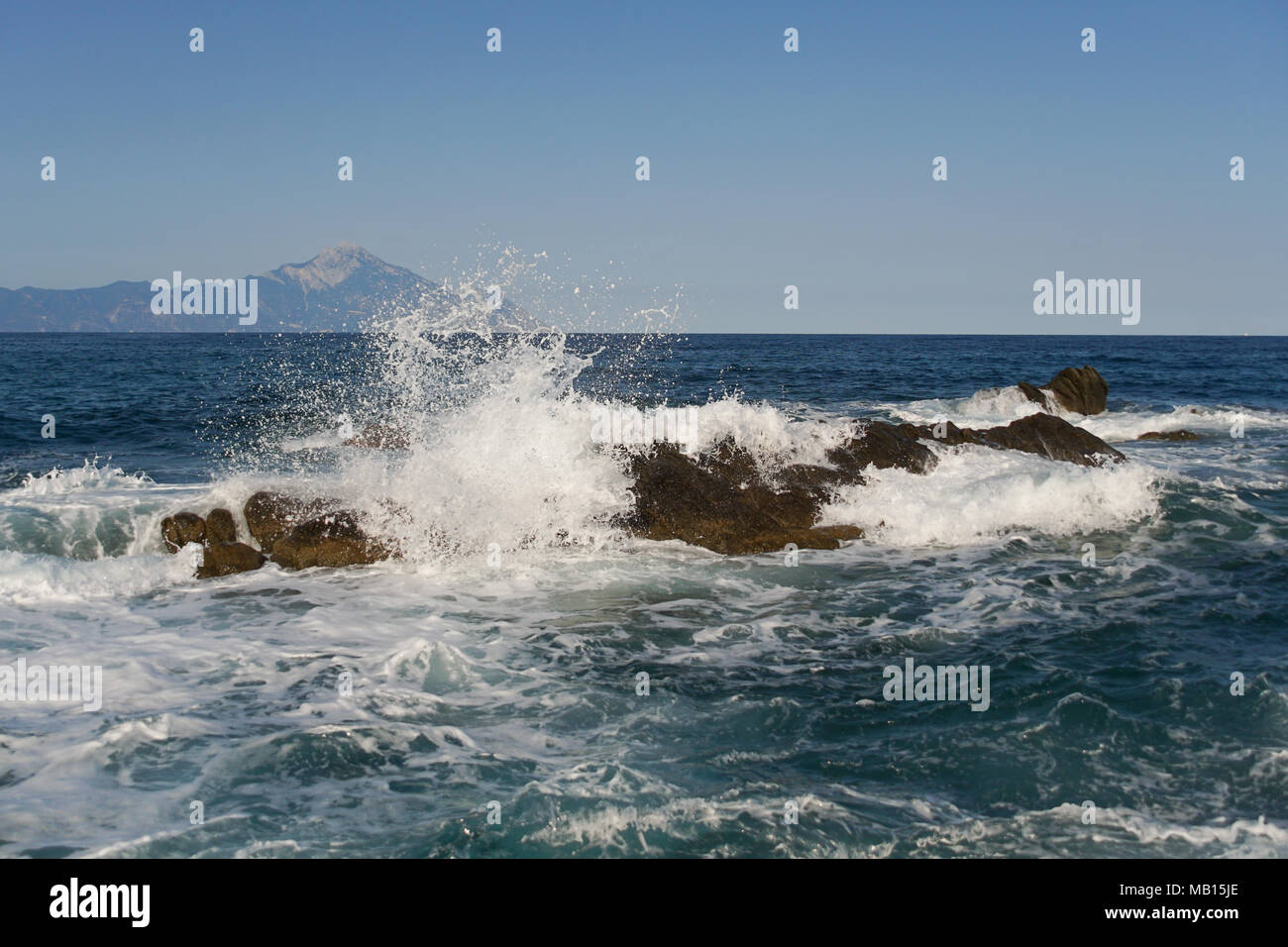 Big rock in the sea with waves Stock Photo - Alamy