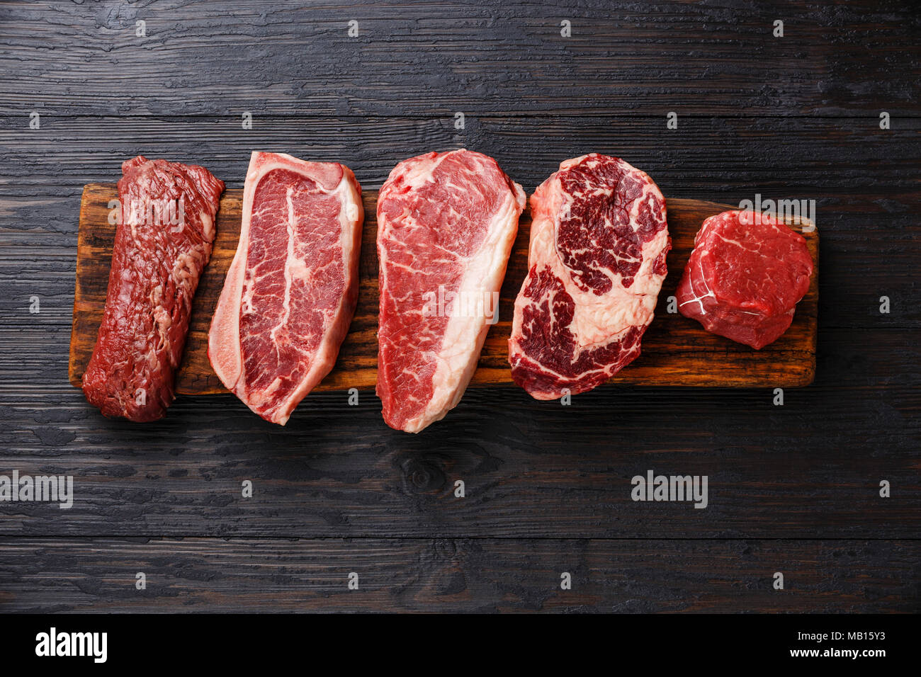 Variety of Raw Black Angus Prime meat steaks Machete, Blade on bone ...