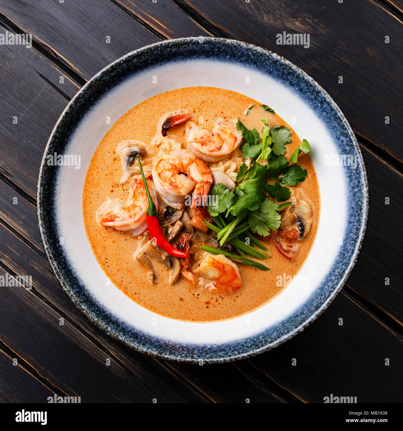 Tom Yam kung Spicy Thai soup with shrimp, seafood, coconut milk and ...