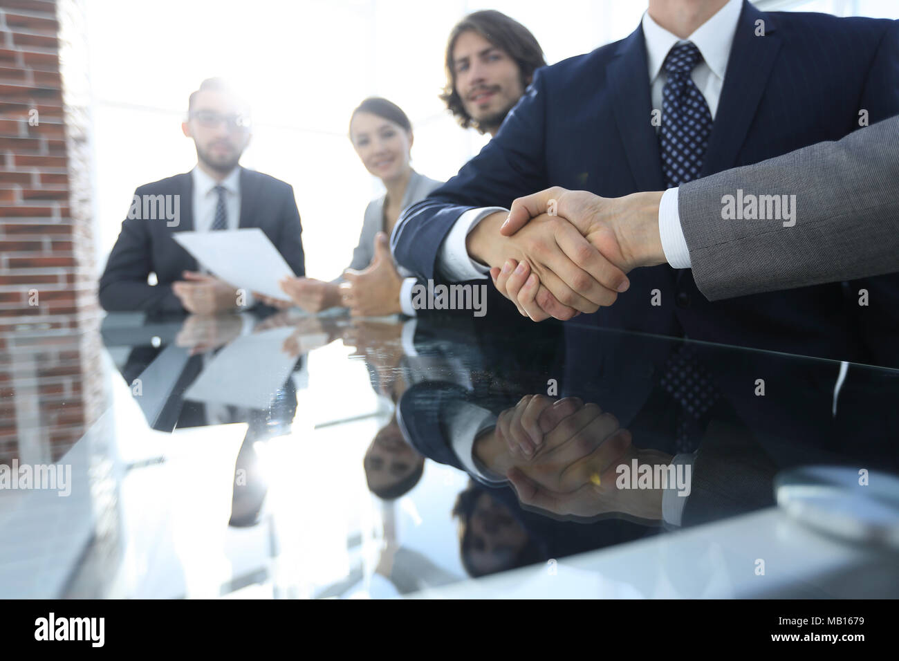 handshake business partners at the meeting Stock Photo - Alamy
