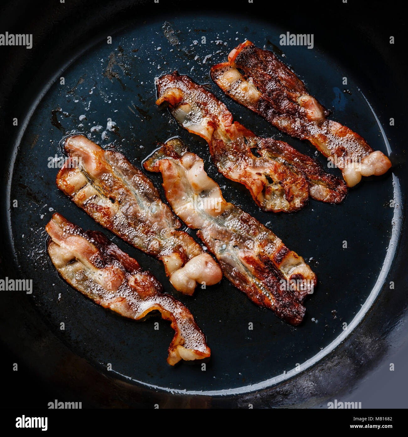 Fry bacon in pan slice hi-res stock photography and images - Alamy