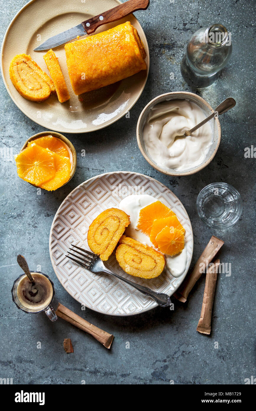 Portuguese orange roulade served with creme fraiche Stock Photo - Alamy