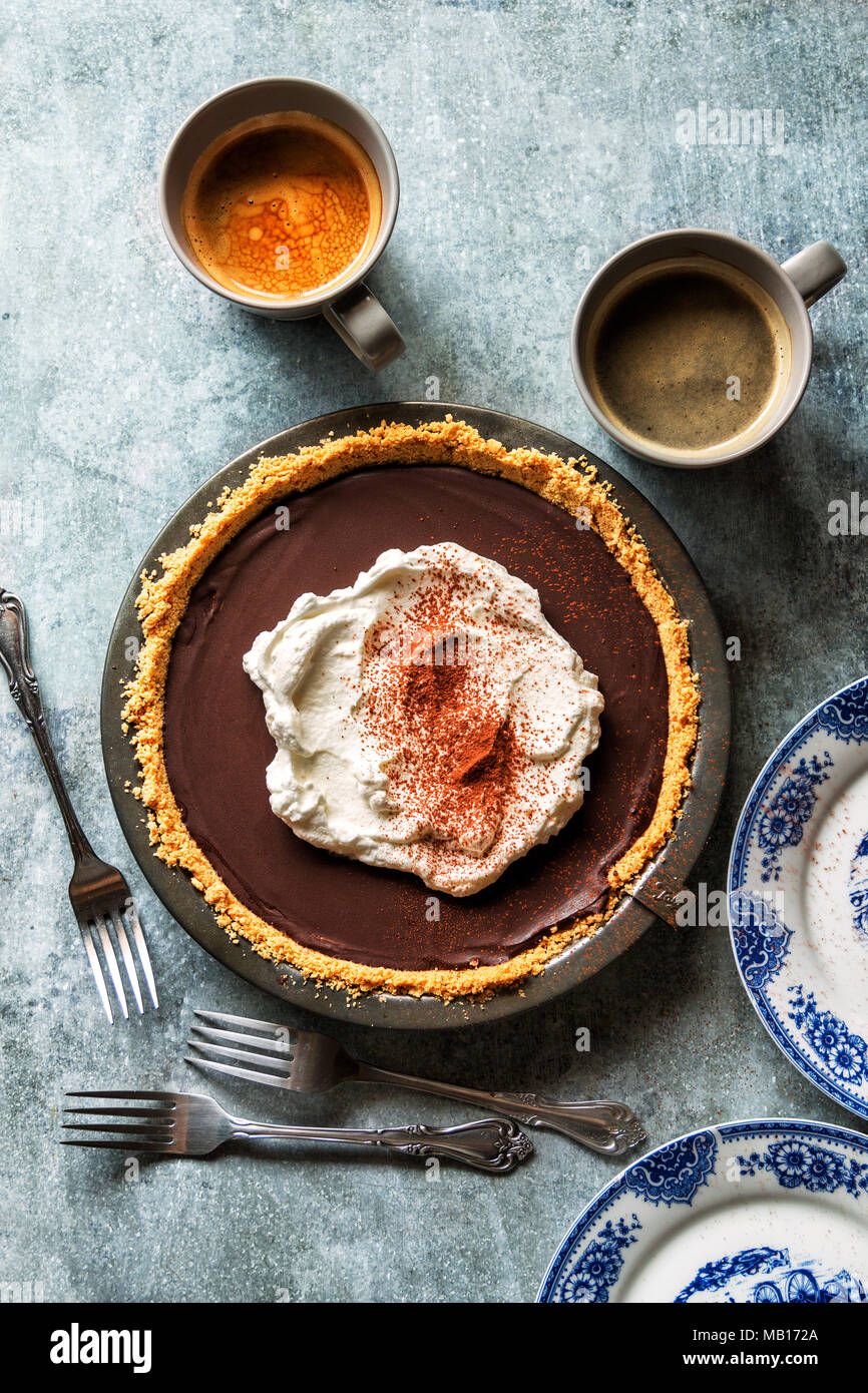 Chocolate pie with whipped cream on top and dusted with cocoa powder ...