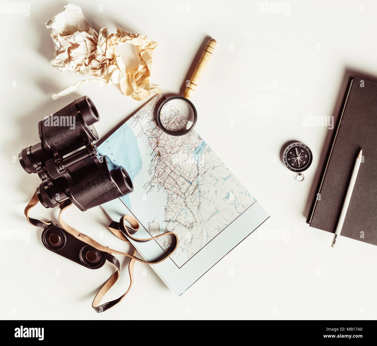 Making a travel plan. Tourist devices on white paper background ...