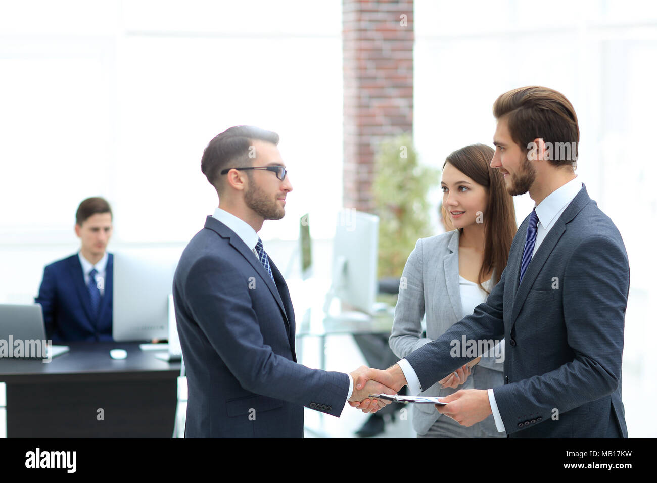 Young man introducing himself at meeting to his partners Stock Photo ...