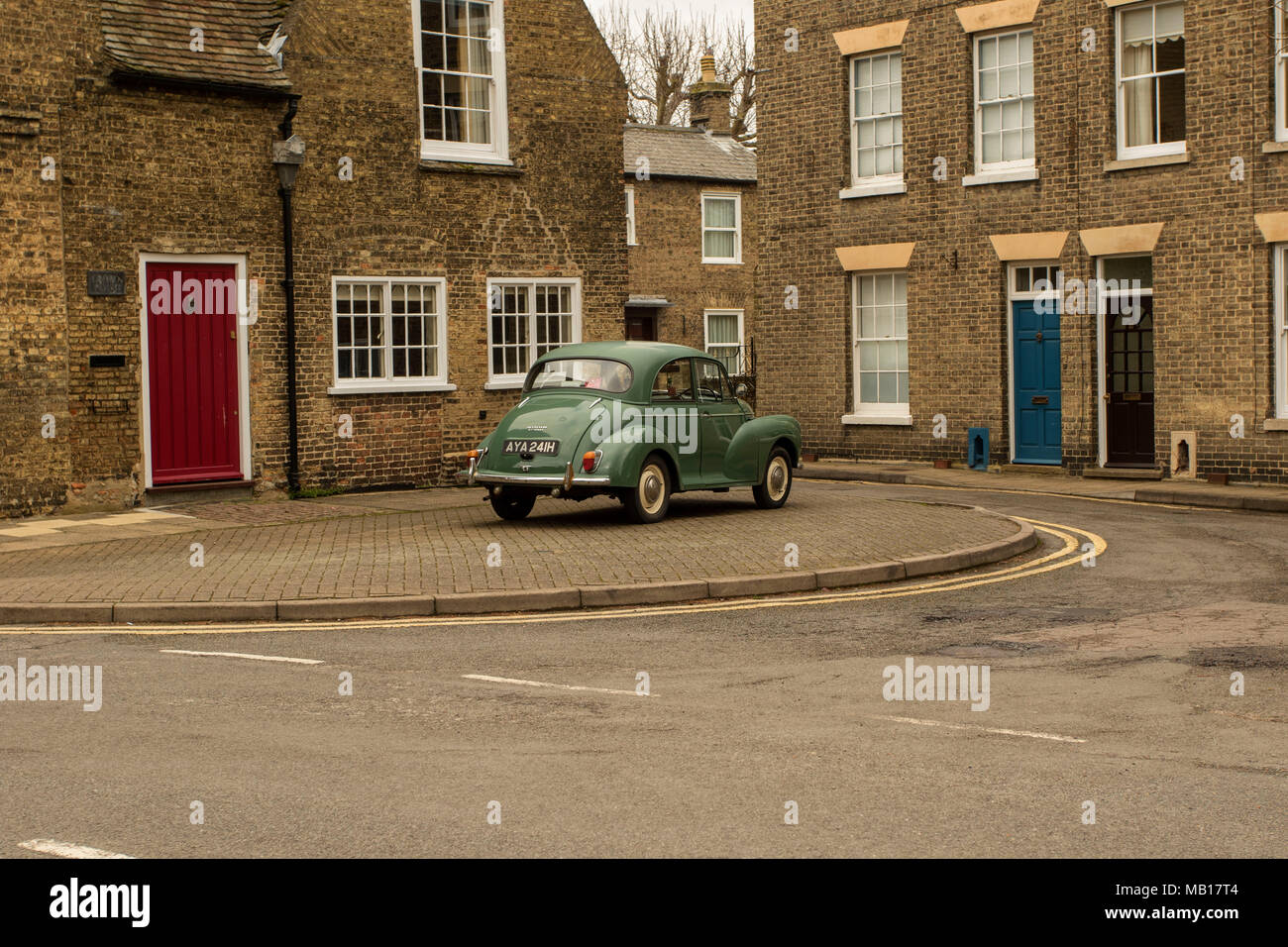 Vintage green car on the pavement outside Cambridgeshire architecture ...