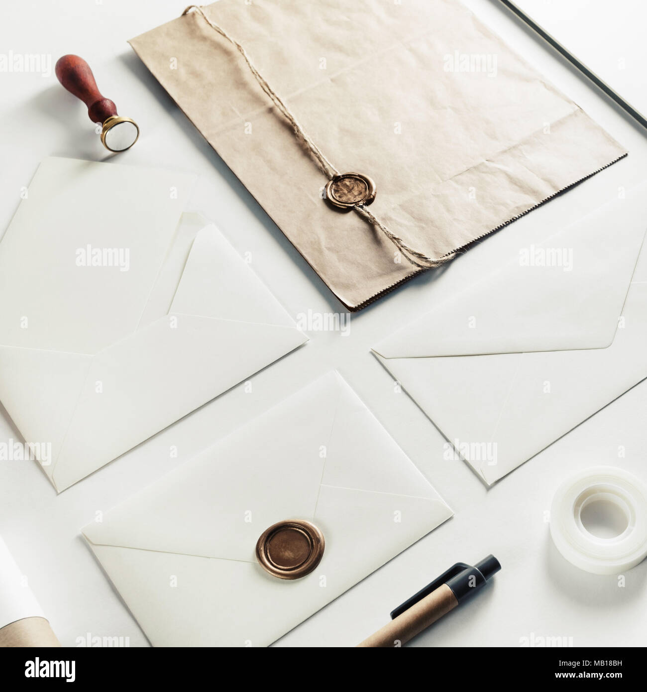 Blank envelopes and stationery set on white paper background. Hand made ...