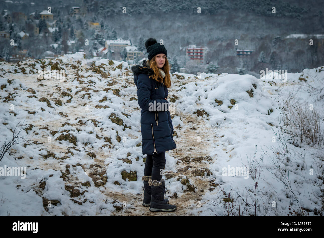 Pretty teen girl in snow, facing camera, winter theme. Beautiful ...